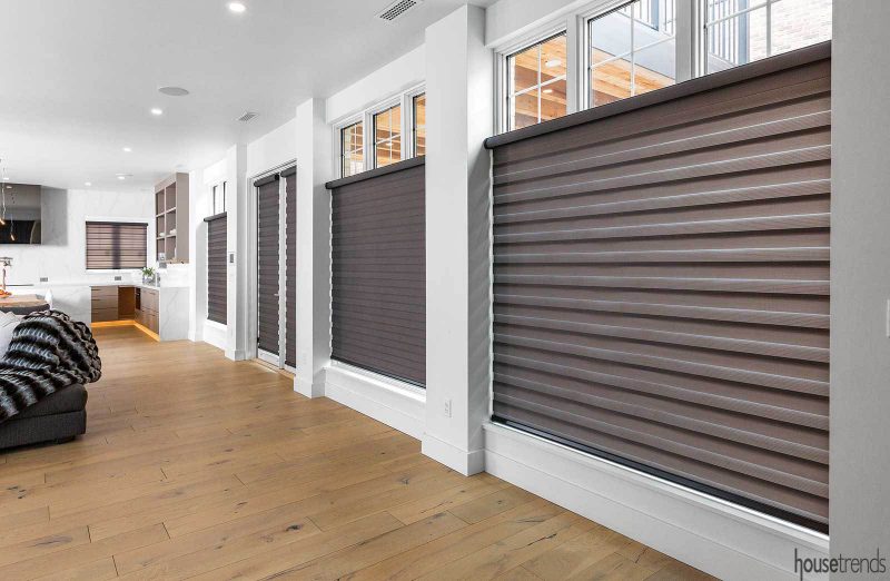 New home accentuates windows and wood by playing with texture